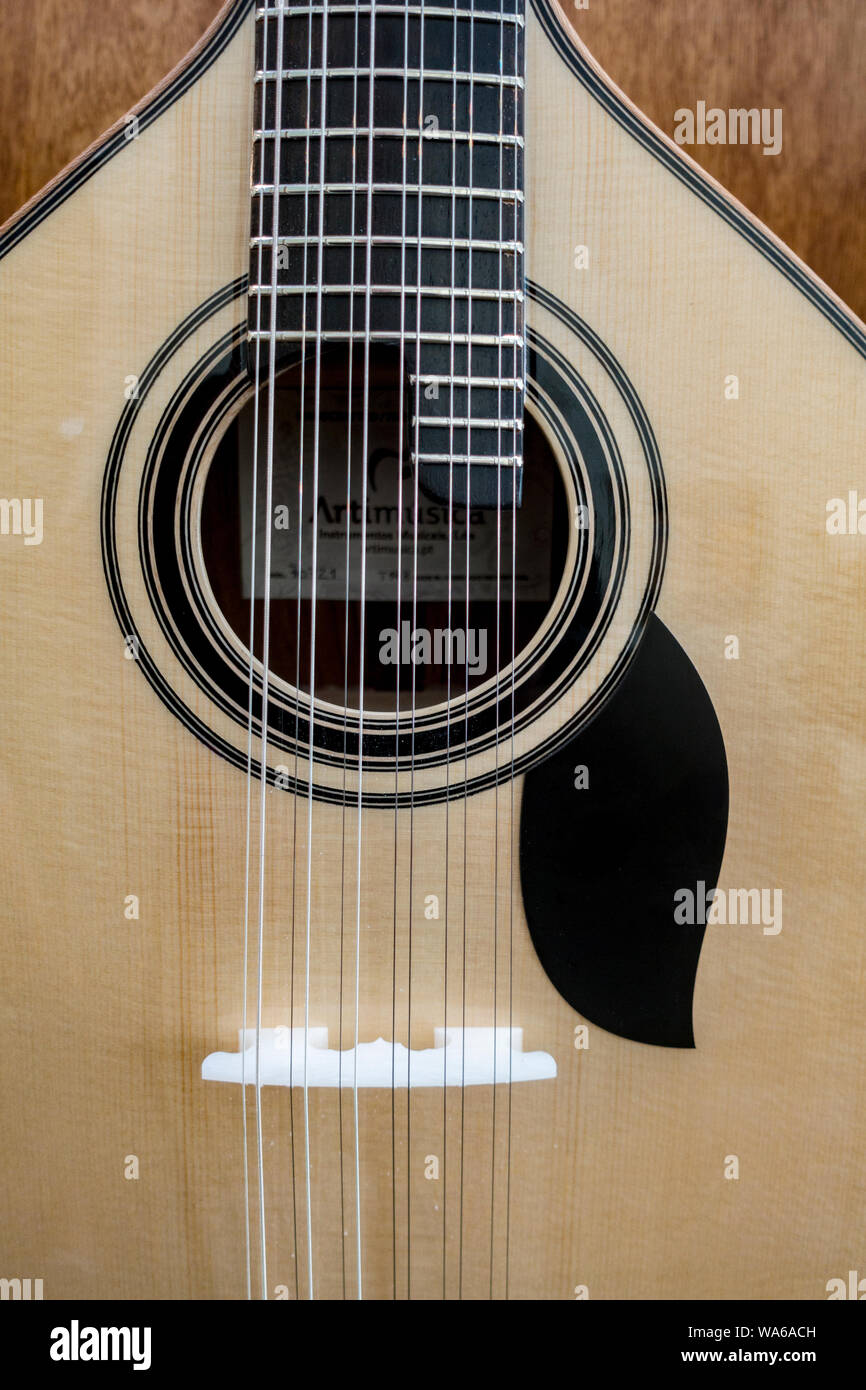 Closeup of soundhole and frets of a 12 string Fado guitar Stock Photo ...