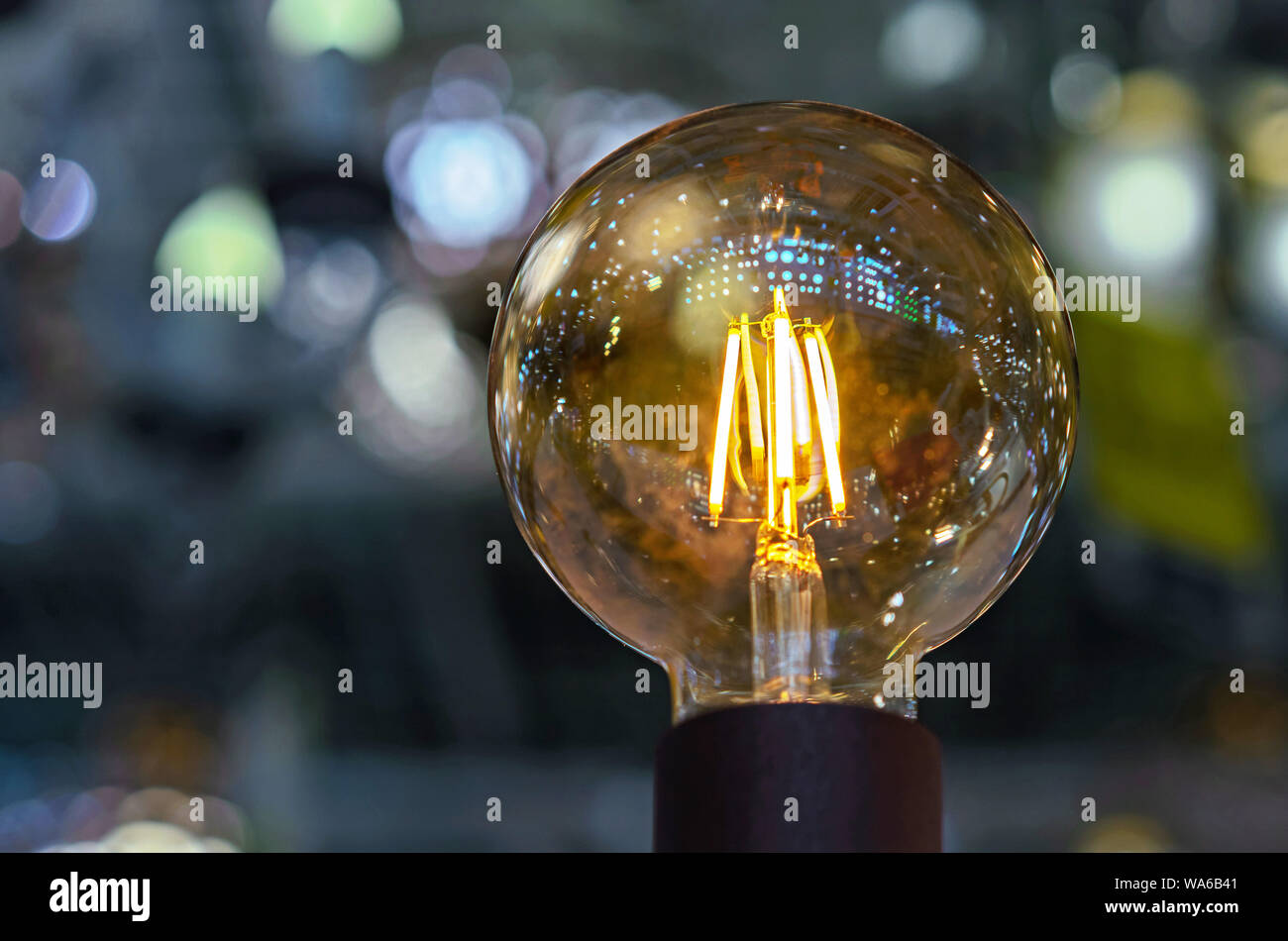 Round light bulb with dark glass in a loft style Stock Photo - Alamy