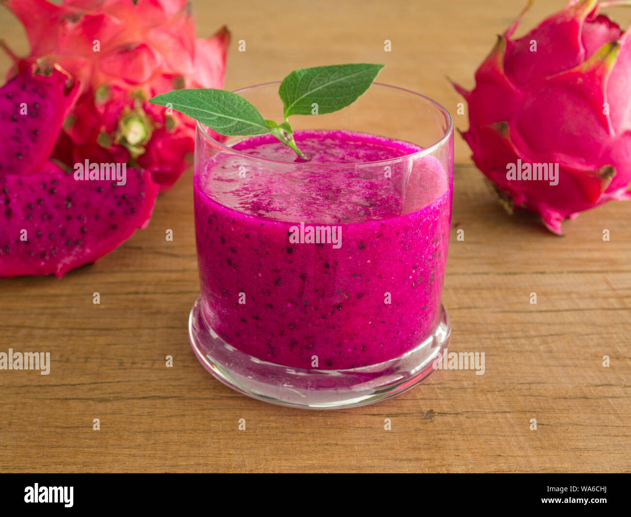 fresh red dragon fruit juice and sliced on wood background Stock Photo ...