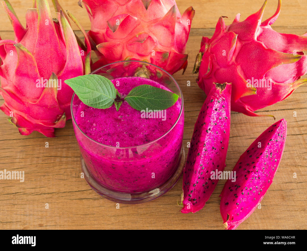 fresh red dragon fruit juice and sliced on wood background Stock Photo ...