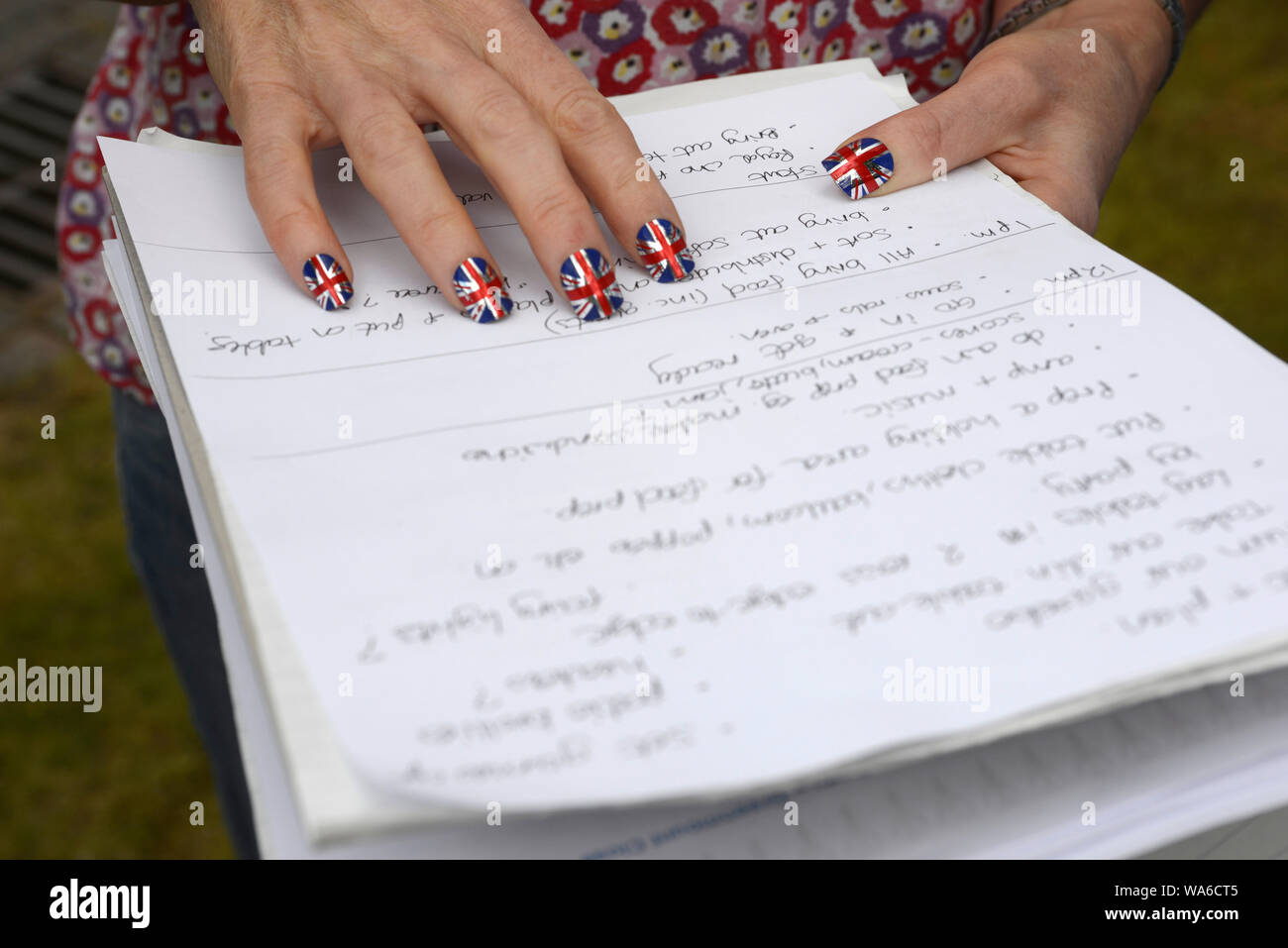 A very British List, with woman's hands Stock Photo - Alamy