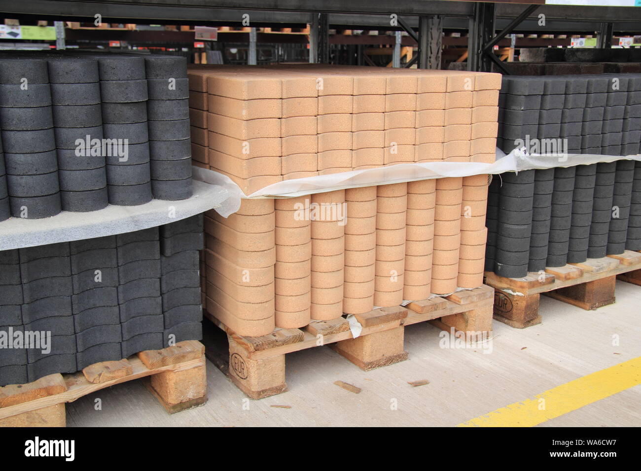 Pallets with stones in a hardware store Stock Photo - Alamy