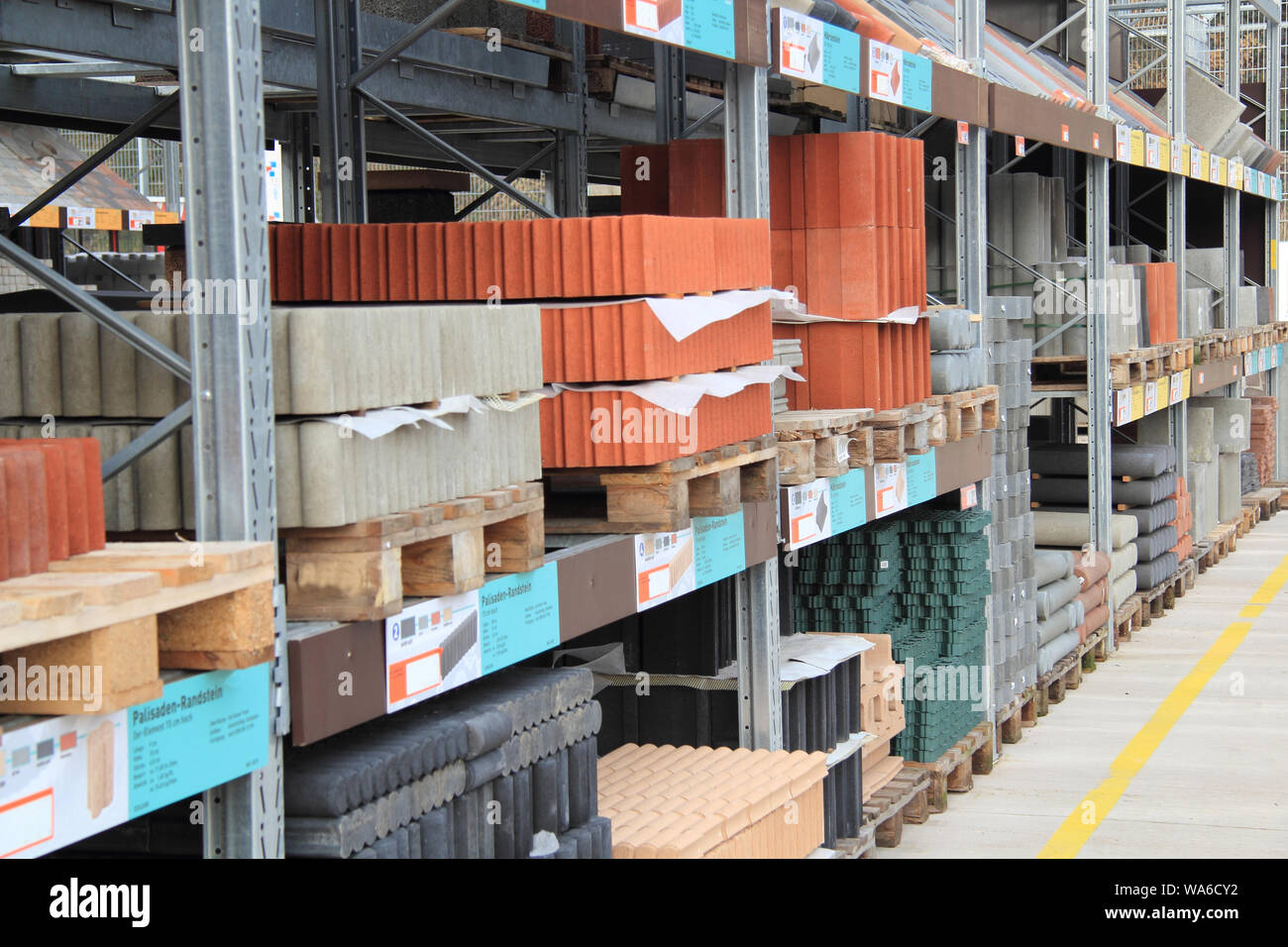 Pallets with stones in a hardware store Stock Photo - Alamy