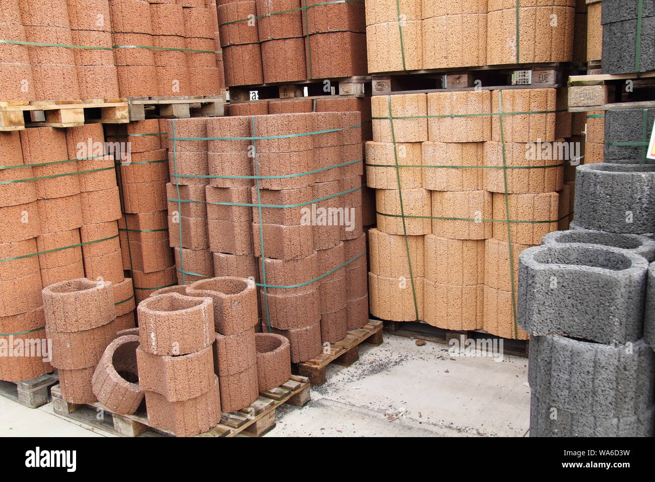Pallets with stones in a hardware store Stock Photo - Alamy