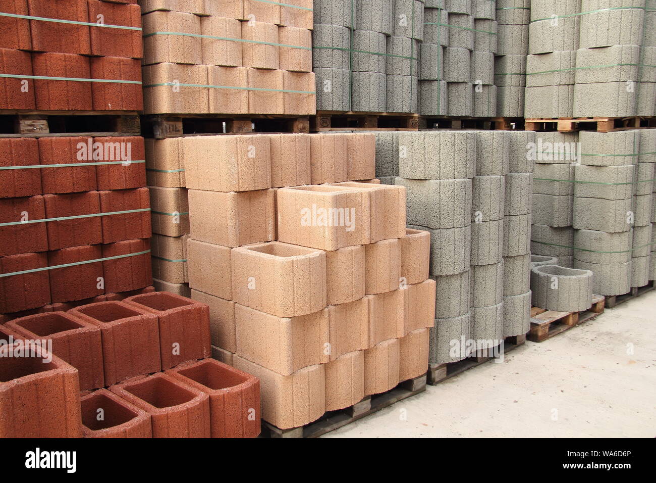 Pallets with stones in a hardware store Stock Photo - Alamy