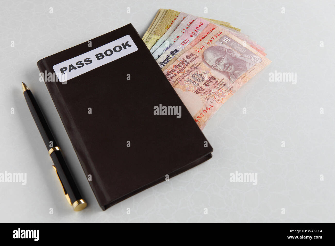 Indian rupees on a bank book Stock Photo - Alamy