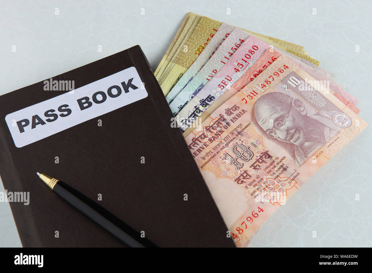 Indian rupees on a bank book Stock Photo - Alamy