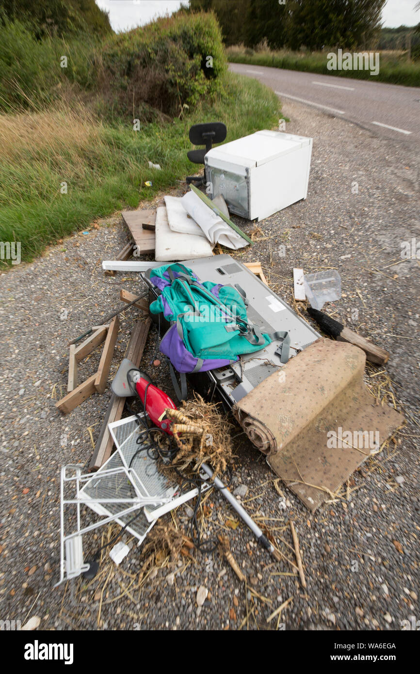 An example of fly-tipping next to a country road in Dorset. Items ...