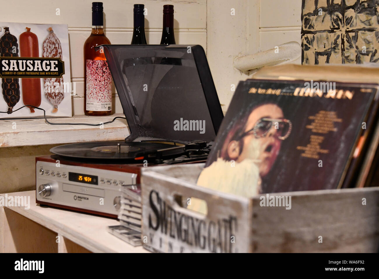 Vinyl Records & Record Player with Sausage Book and Bottles of Wine and ...