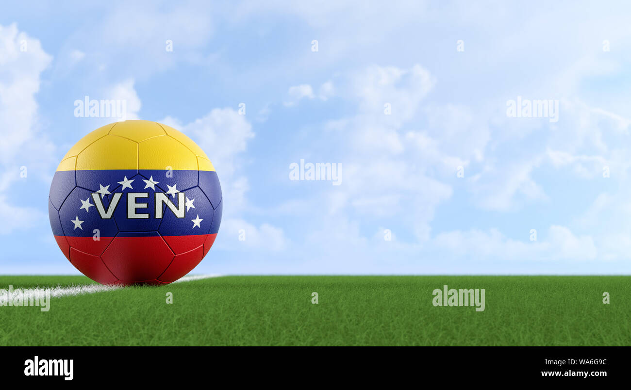 Soccer ball in Venezuela national colors on a soccer field. Copy space ...