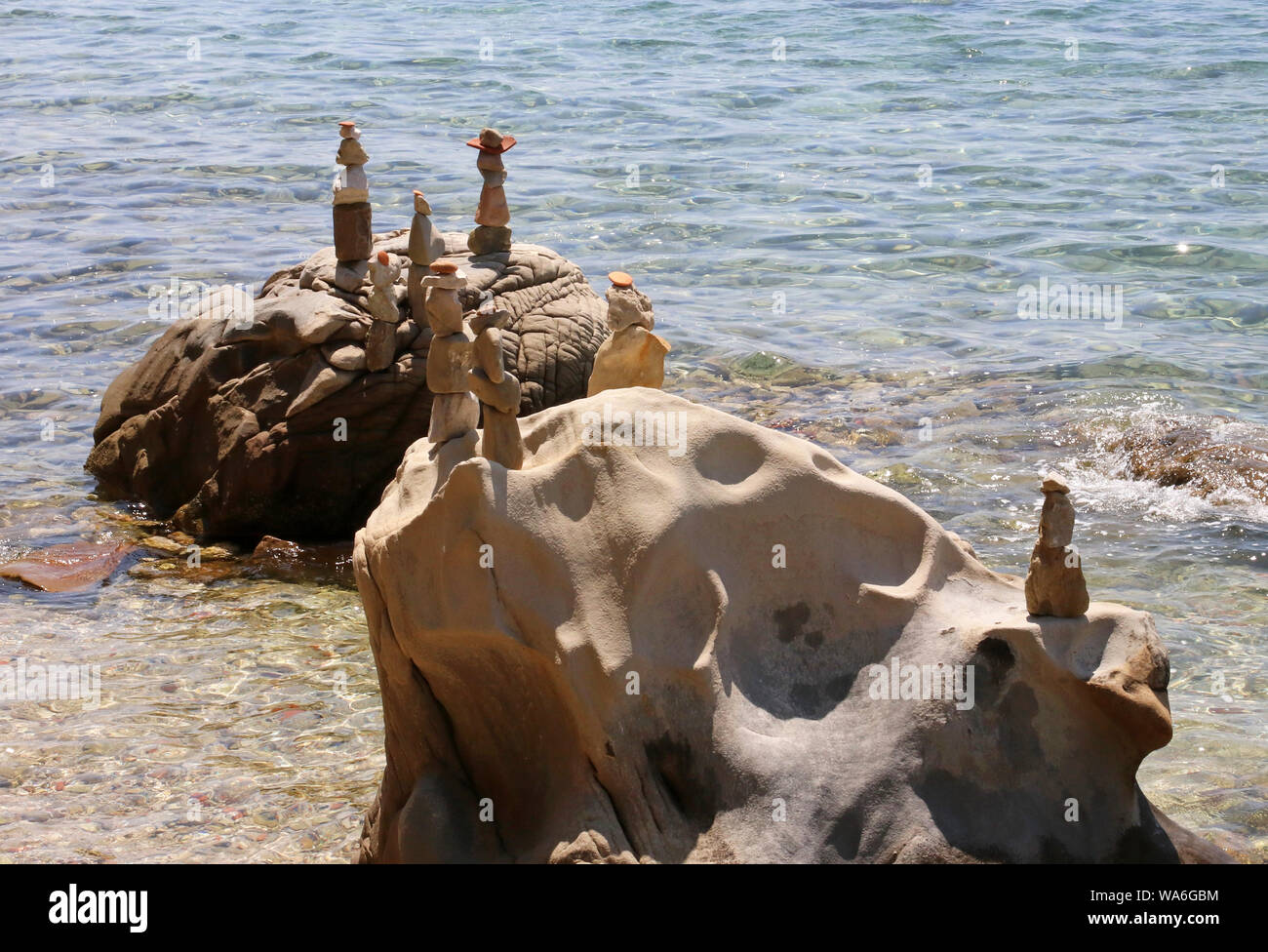 natural stones used to produce artwork that looks like small people ...