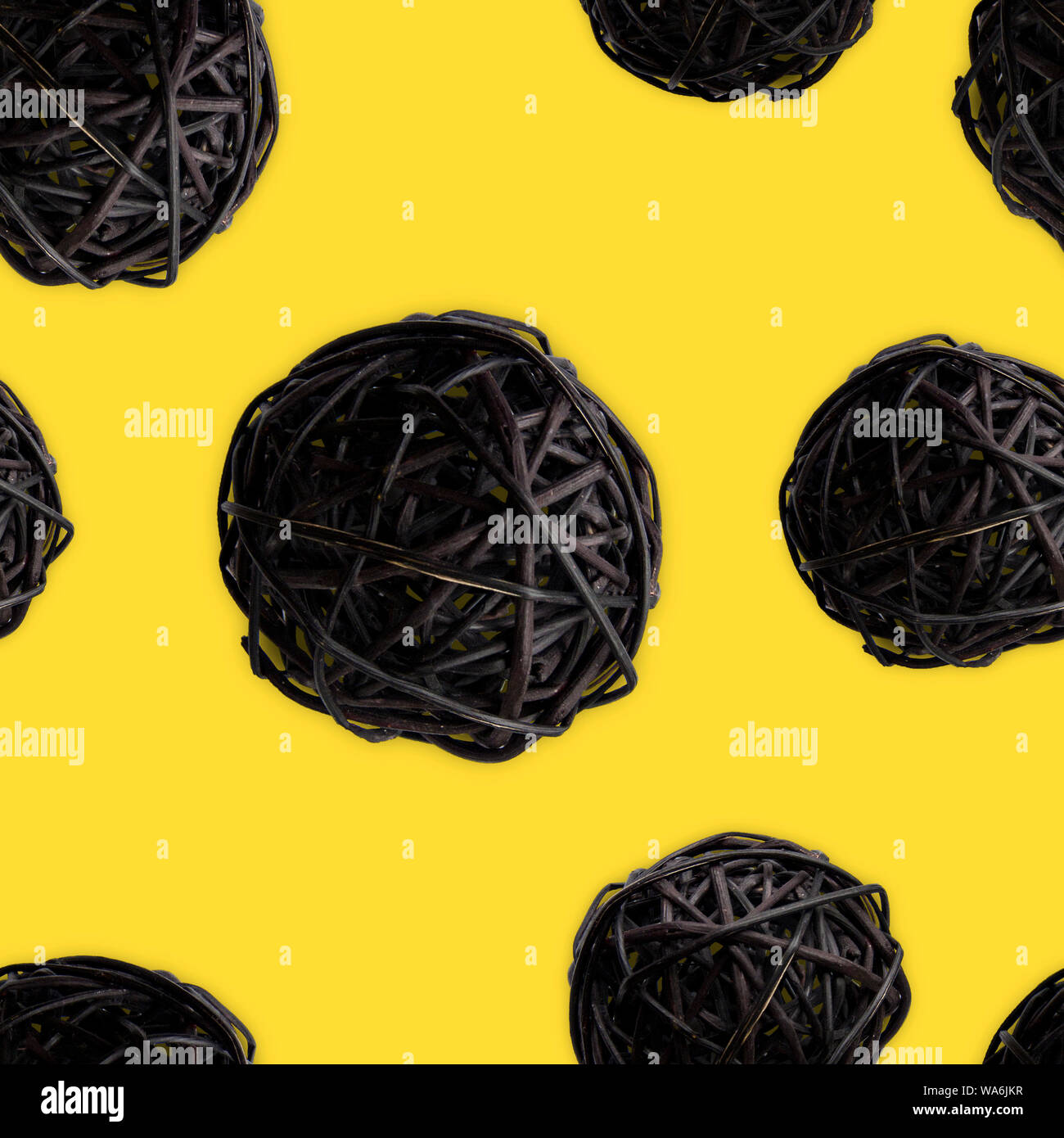 Decorative rattan ball isolated on yellow background. Seamless pattern ...