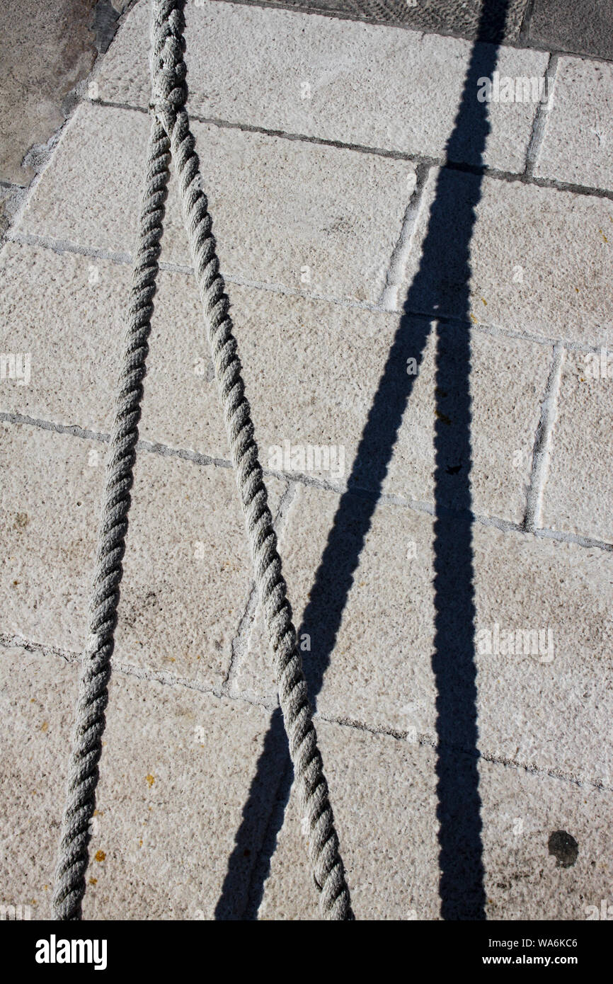 Ship cord or ropes with shadow gives M letter as a mooring, as Marina ...