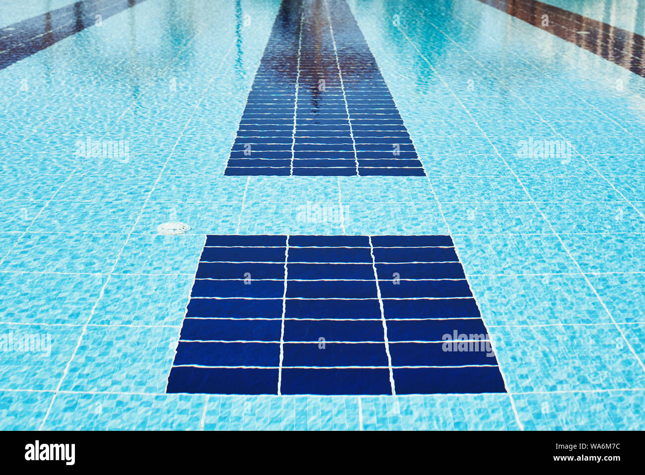 Background of water in blue swimming pool, water surface with sun ...
