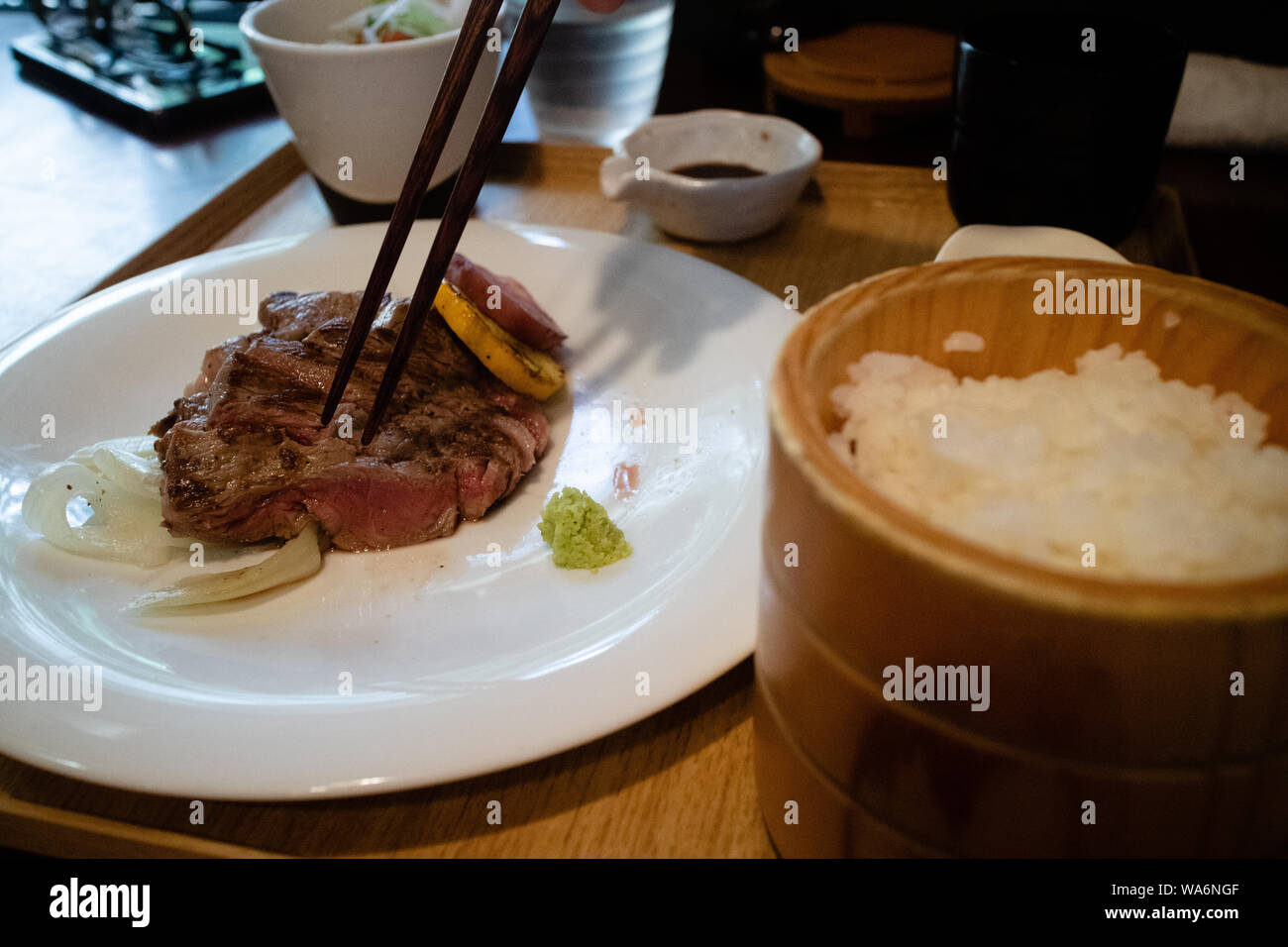 Eating perfectly cooked steak in high-class Japanese restaurant Stock ...
