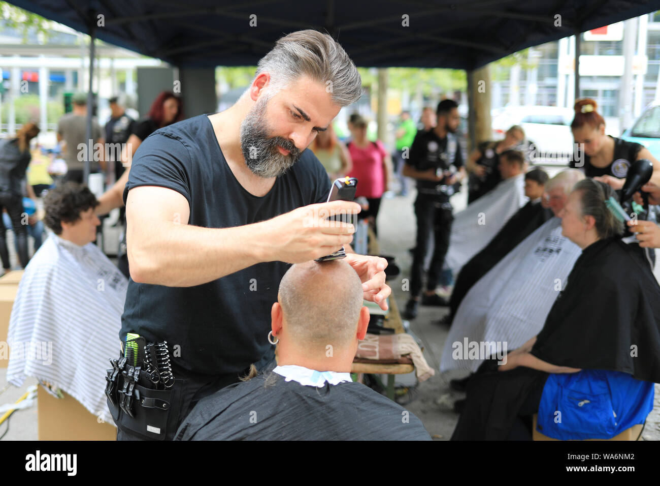 Magdeburg, Germany. 18 August 2019. Hairdresser Lutz Saebelfeld from ...