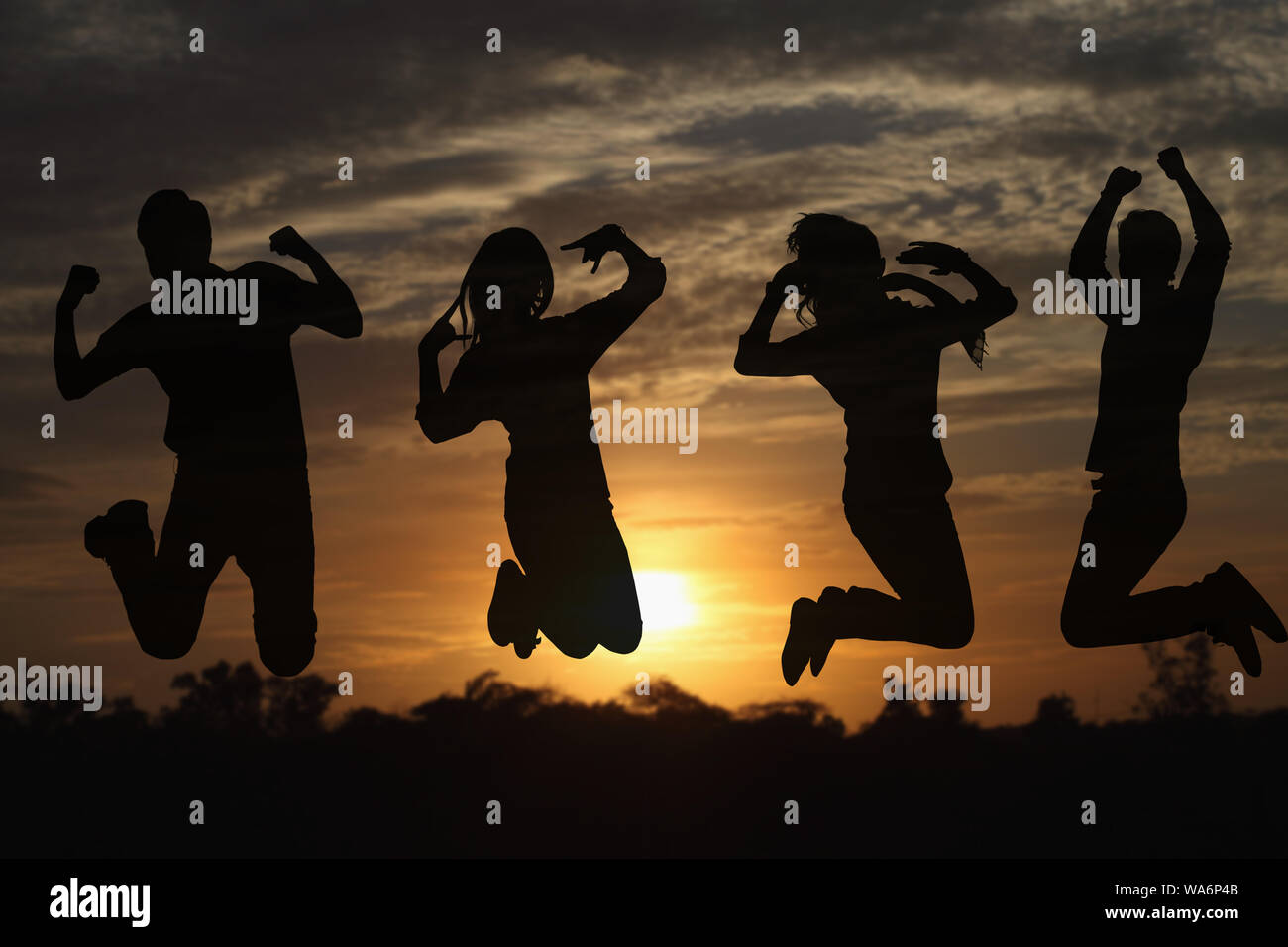 Group of friends jumping in air Stock Photo - Alamy