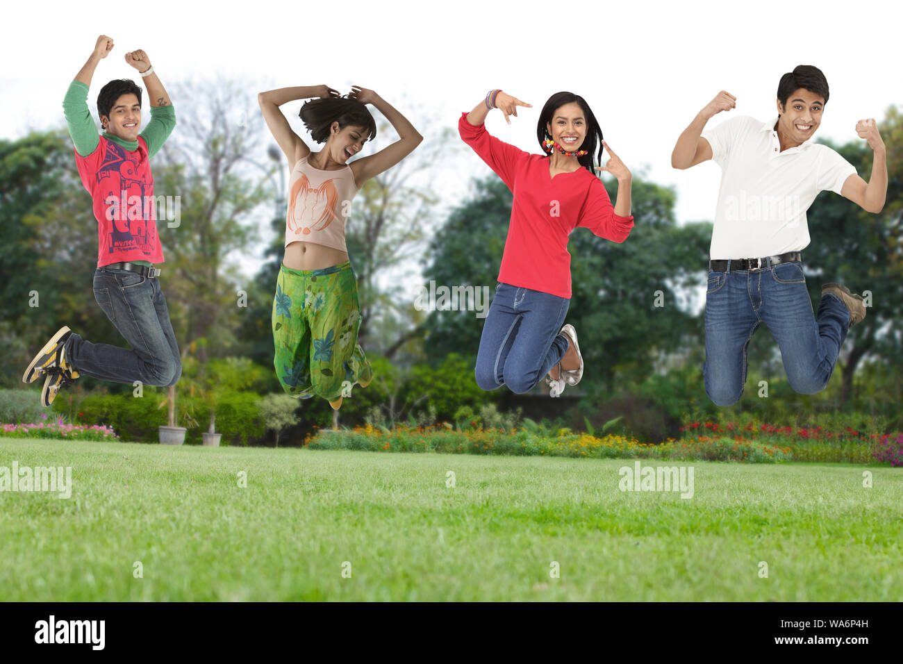 Group of friends jumping in air and smiling Stock Photo - Alamy