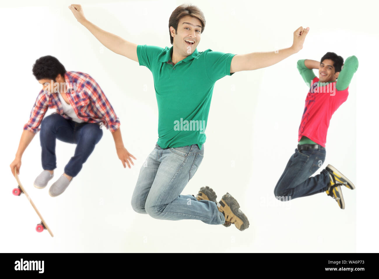 Young men jumping in mid air Stock Photo - Alamy