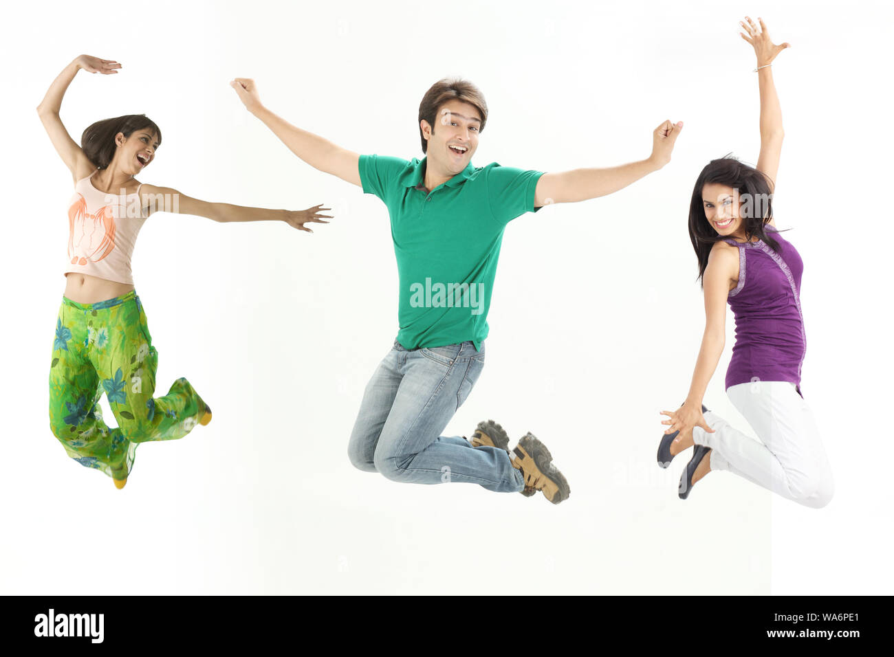 Group of friends jumping in mid air and smiling Stock Photo - Alamy