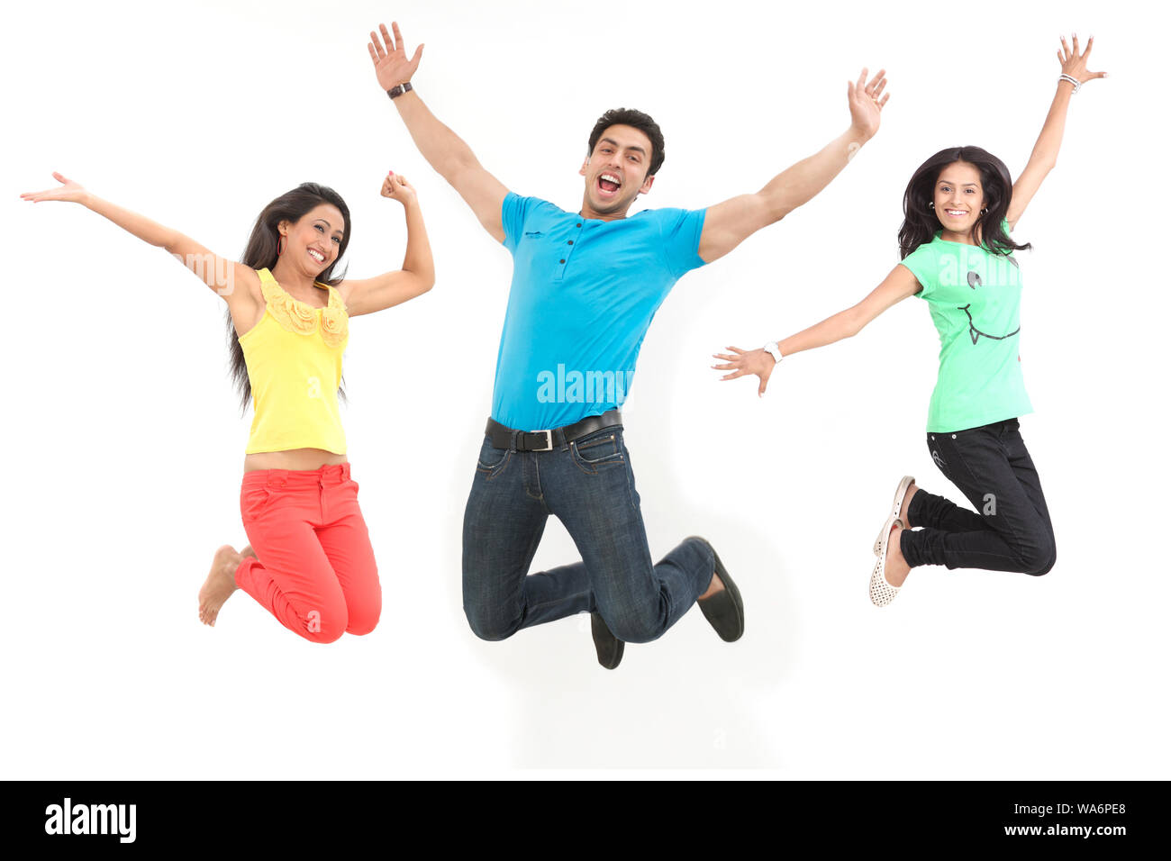 Group of friends jumping in mid air and smiling Stock Photo - Alamy