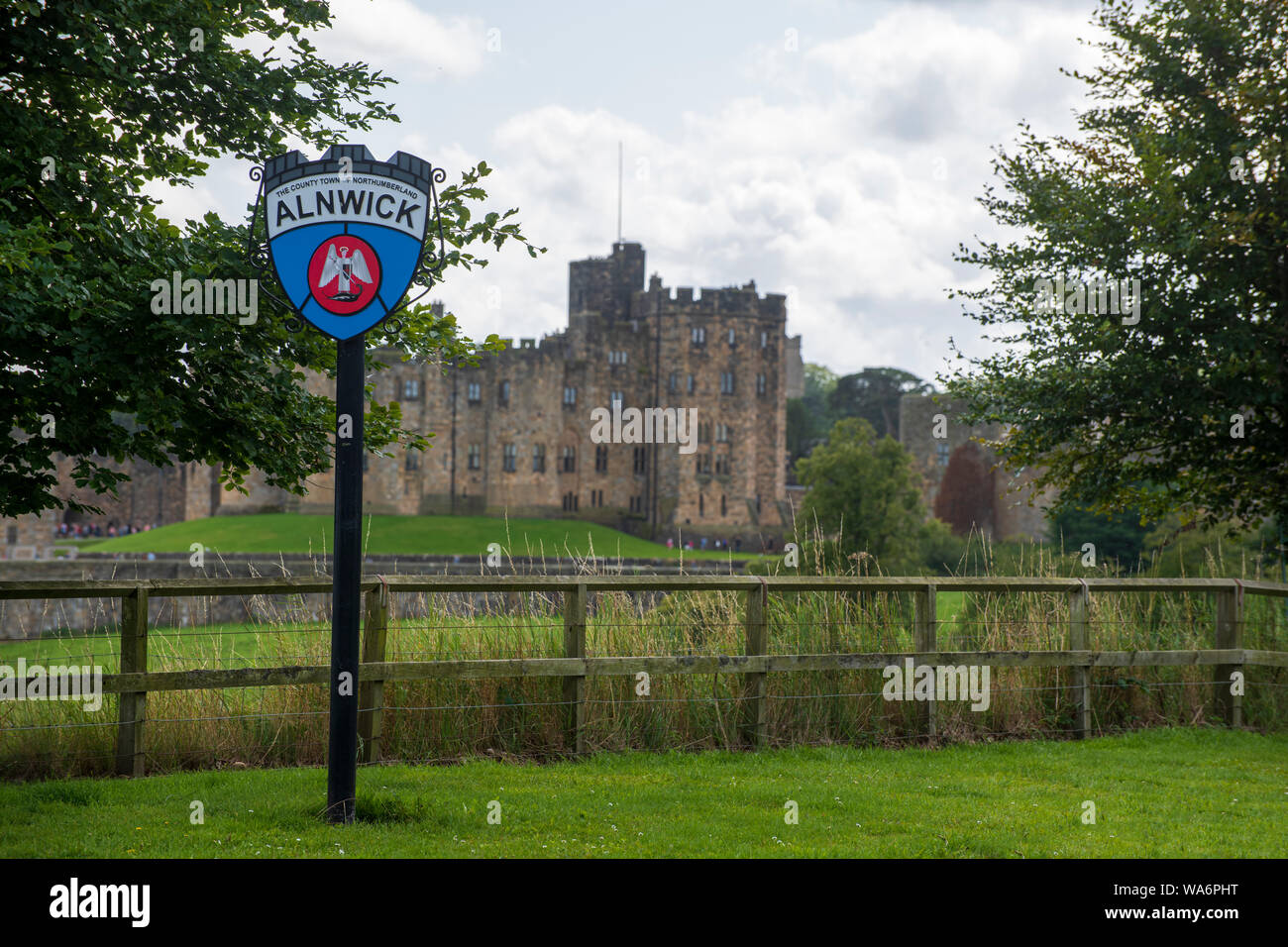 Town sign For Alnwick with Castle in Background Stock Photo - Alamy