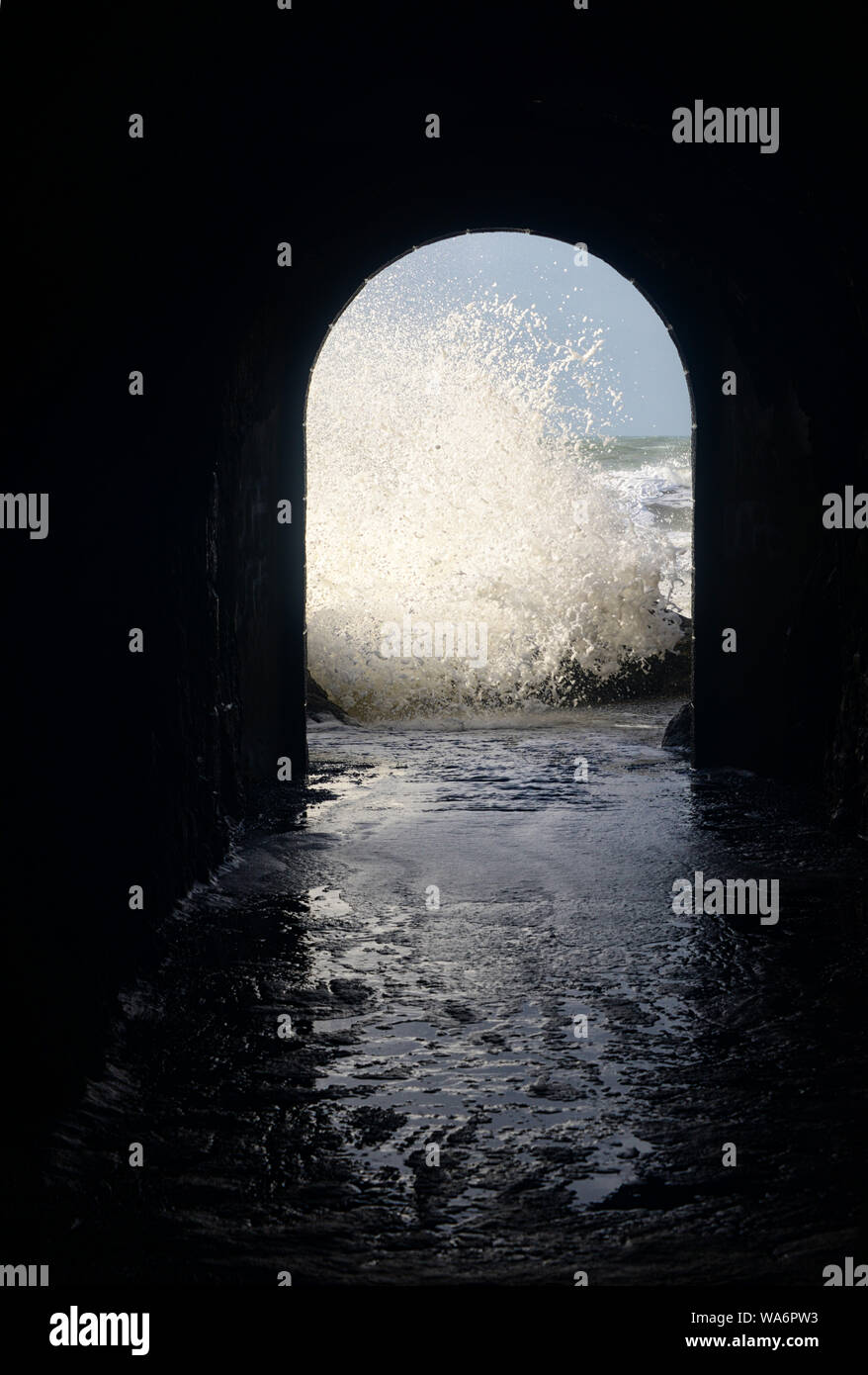 Tunnel and wave Stock Photo - Alamy