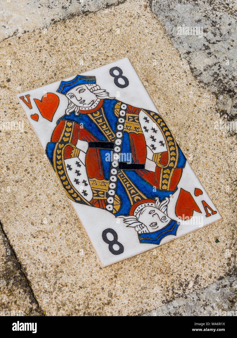 Ceramic tile depicting playing card, set in pavement - Montmorillon ...