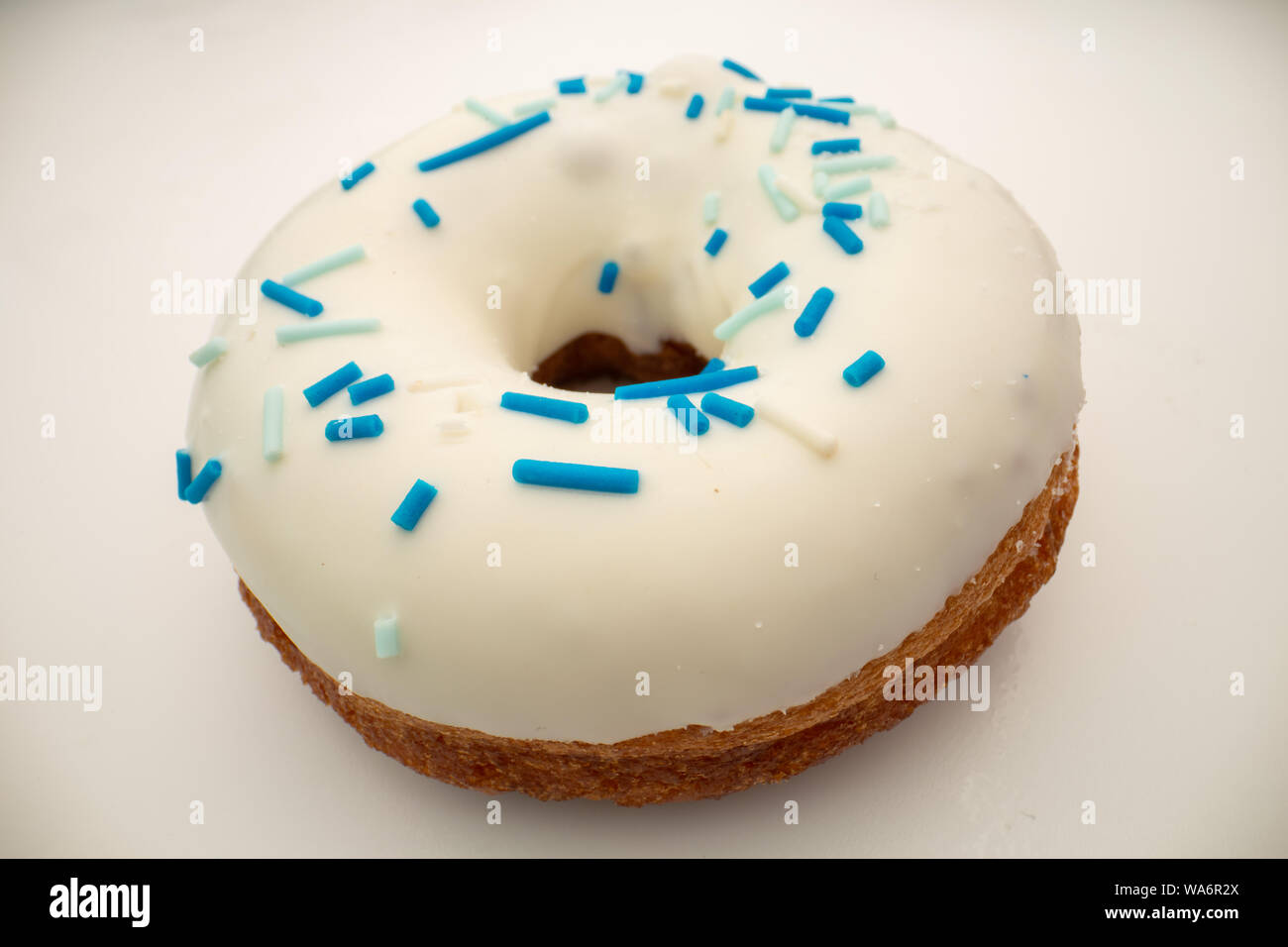junk food concept - Big donut with white glaze Stock Photo - Alamy