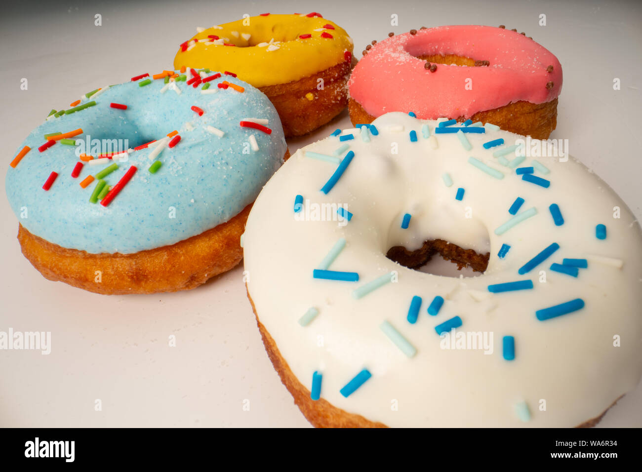 Different big donuts with glaze. Assortment of various colorful donuts ...