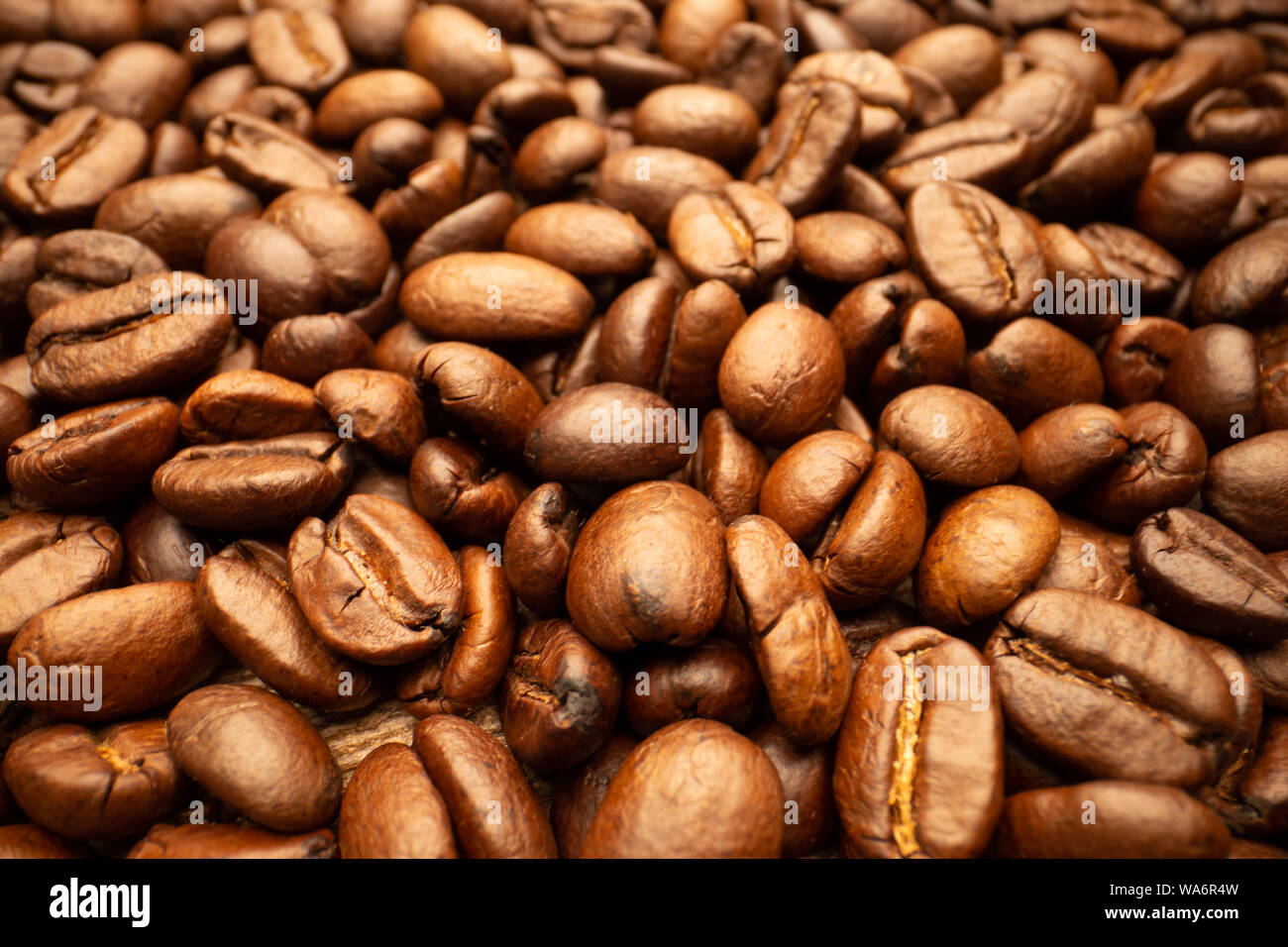 Very big roasted brown coffee beans background Stock Photo - Alamy