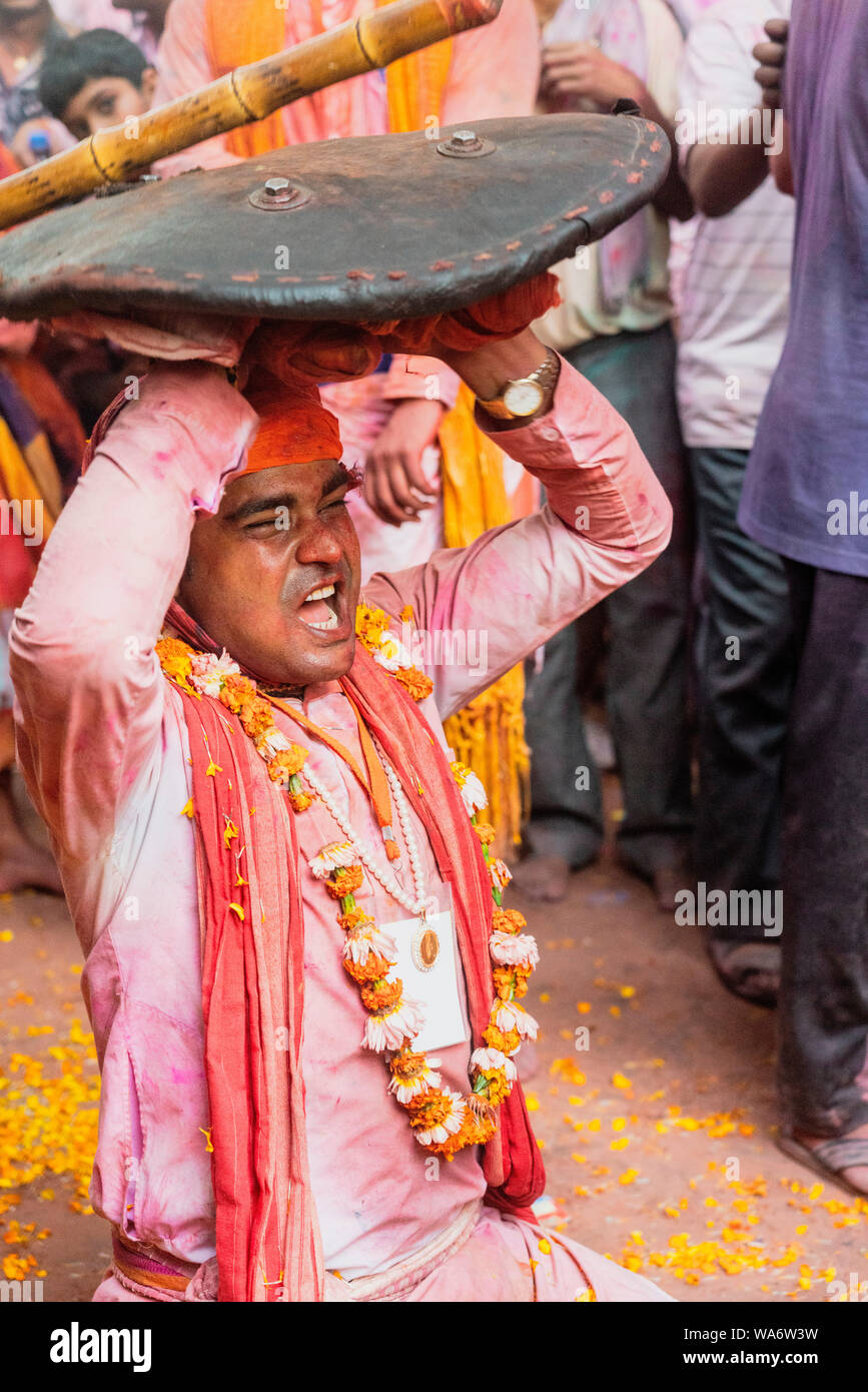 Indian women beating man stick hi-res stock photography and images - Alamy