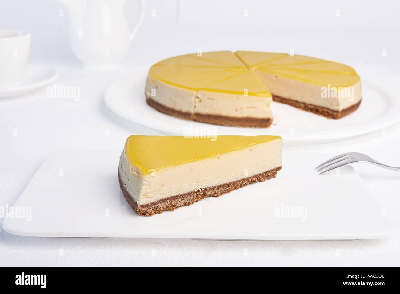 Tasty big piece of cake on a plate on a white background Stock Photo ...