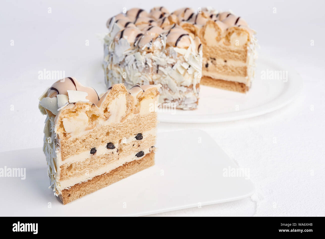 Tasty big piece of cake on a plate on a white background Stock Photo ...