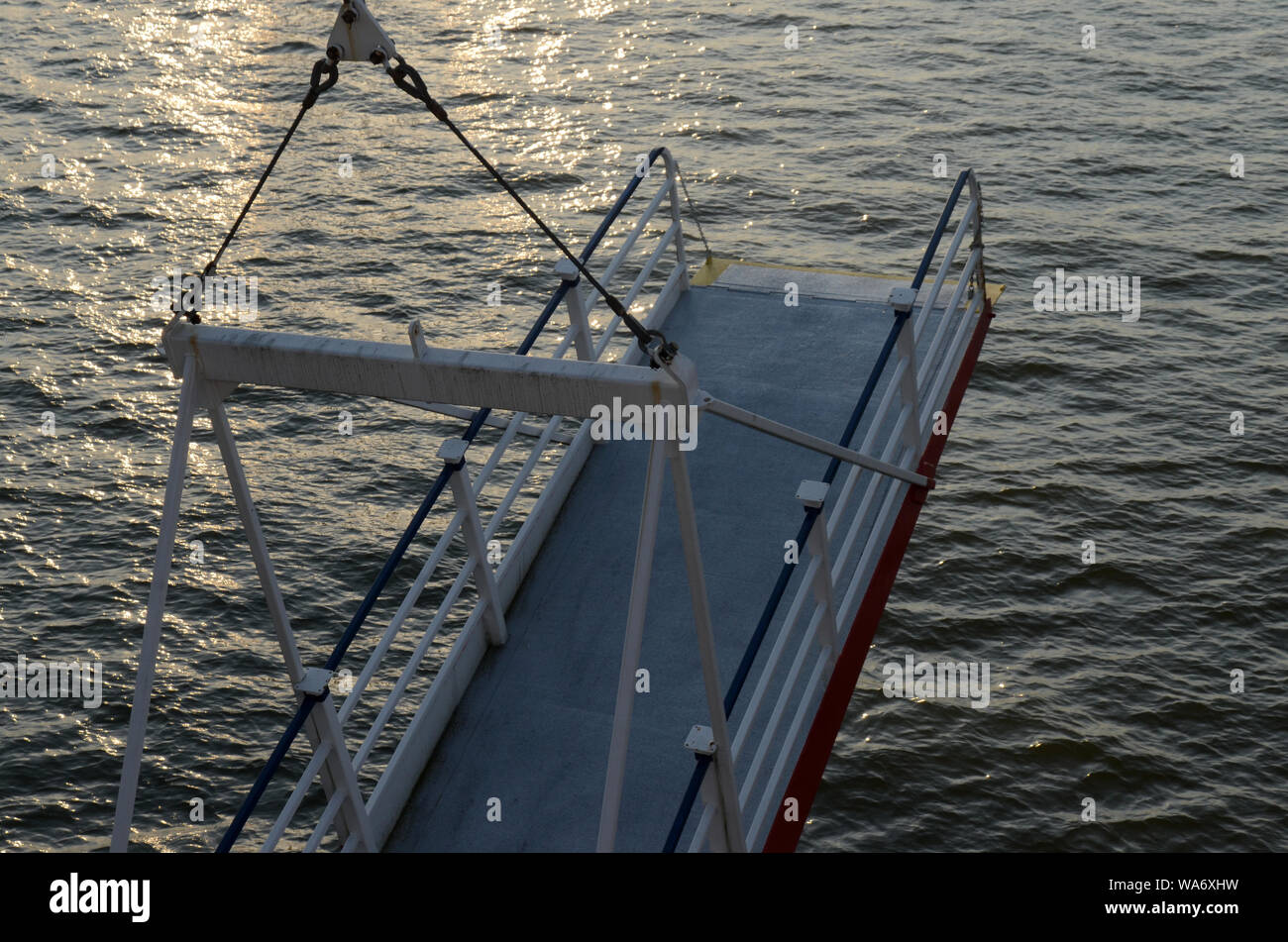 OVERBOARD: The boarding walkways on a riverboat cruise hang out over ...