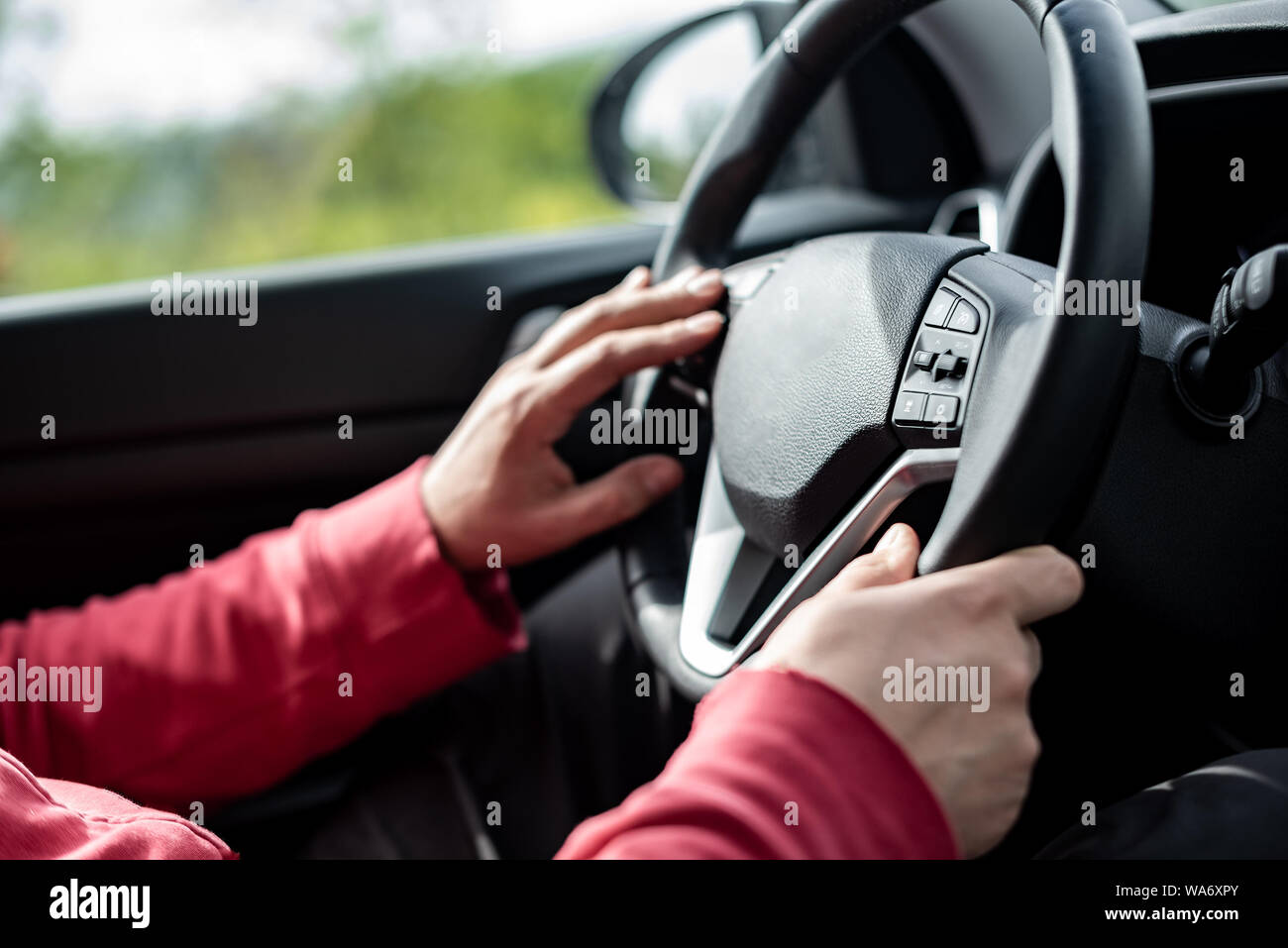 Man hand holding car steering wheel - Male hand close up shallow dof ...