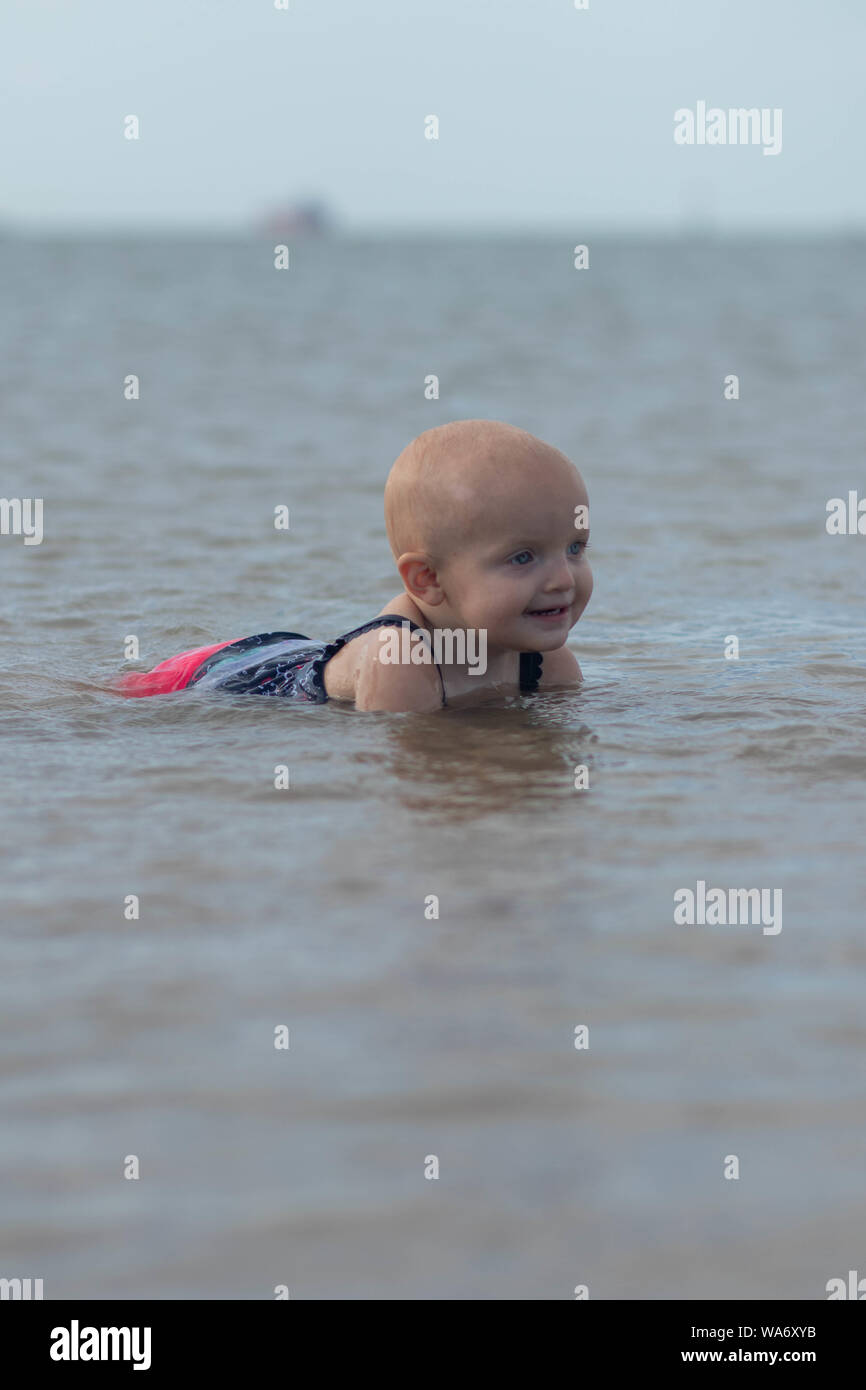 Child in the Ocean Stock Photo - Alamy