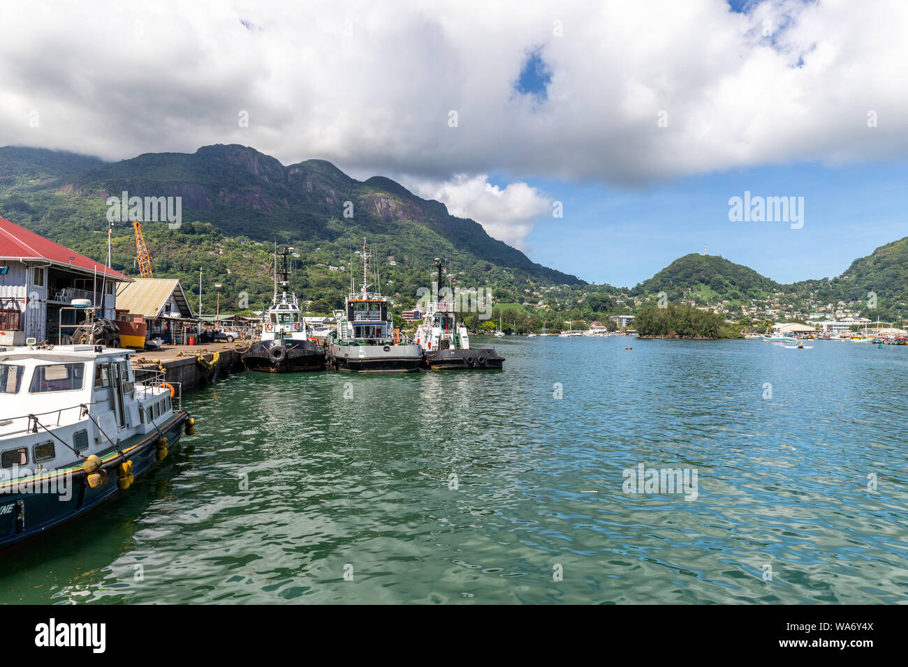 Port Victoria on Seychelles island mahé with mountain range in the ...