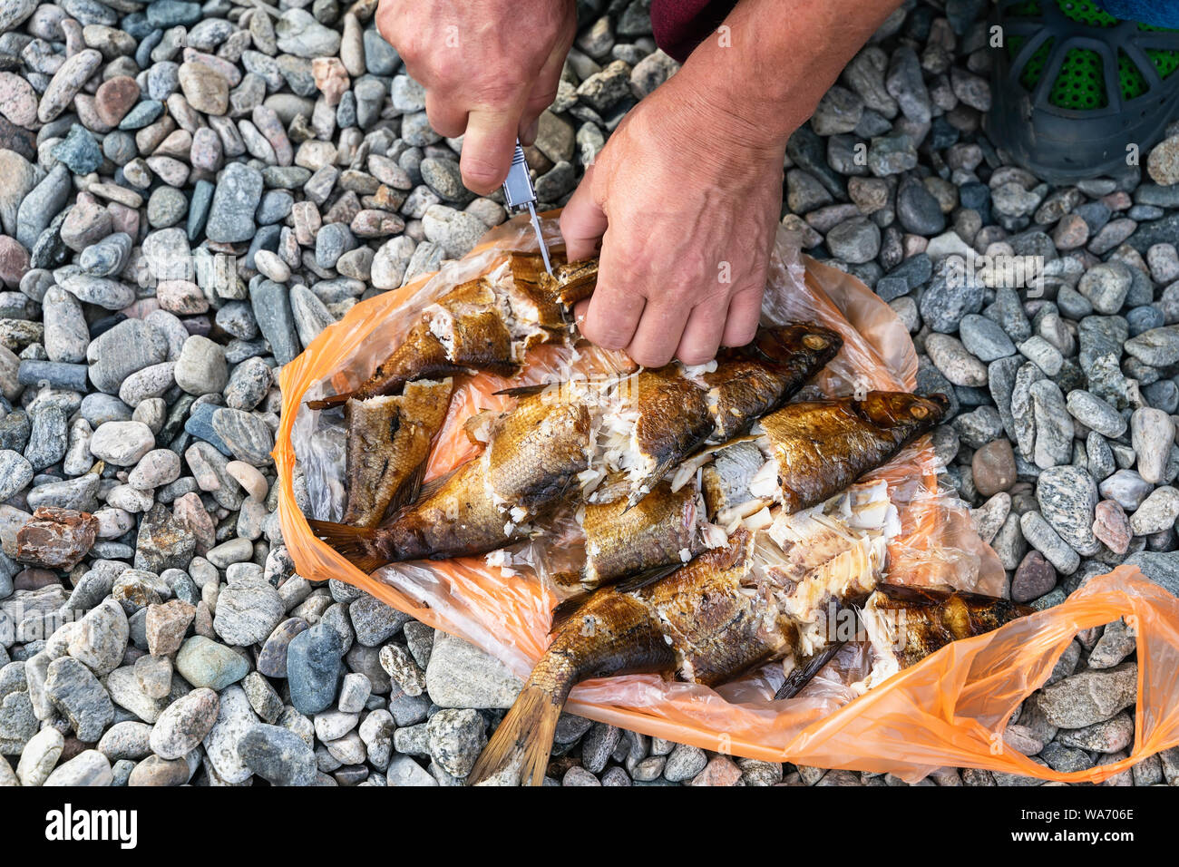 Man beach eating meat hi-res stock photography and images - Alamy