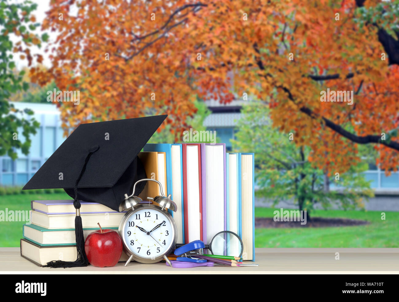 blurry background of university campus in Fall season and book for ...