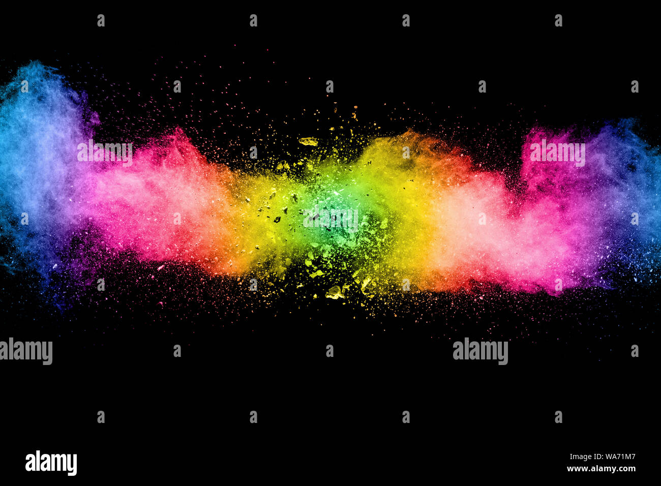 Multicolored powder explosion on black background Stock Photo - Alamy