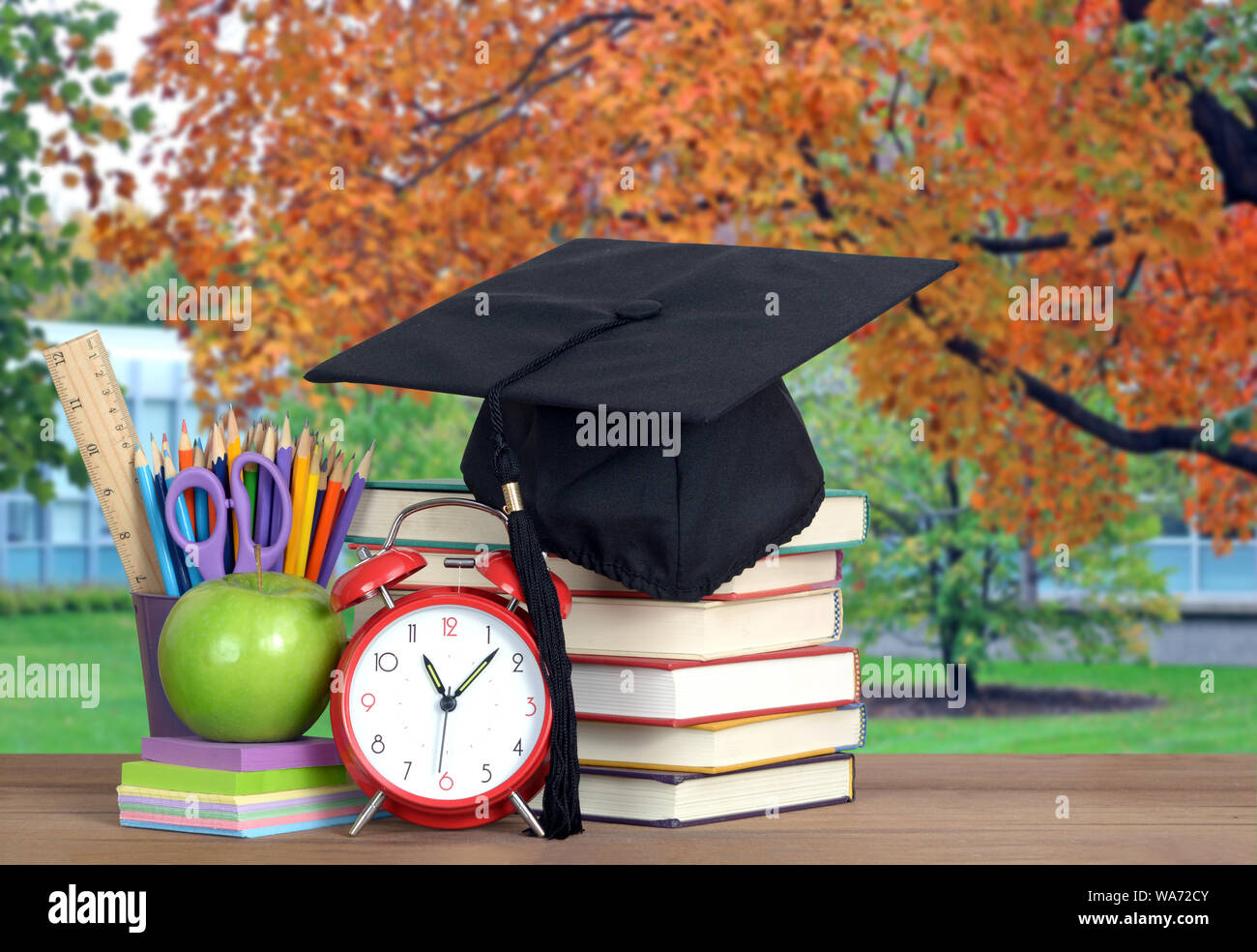 blurry background of university campus in Fall season and book for ...