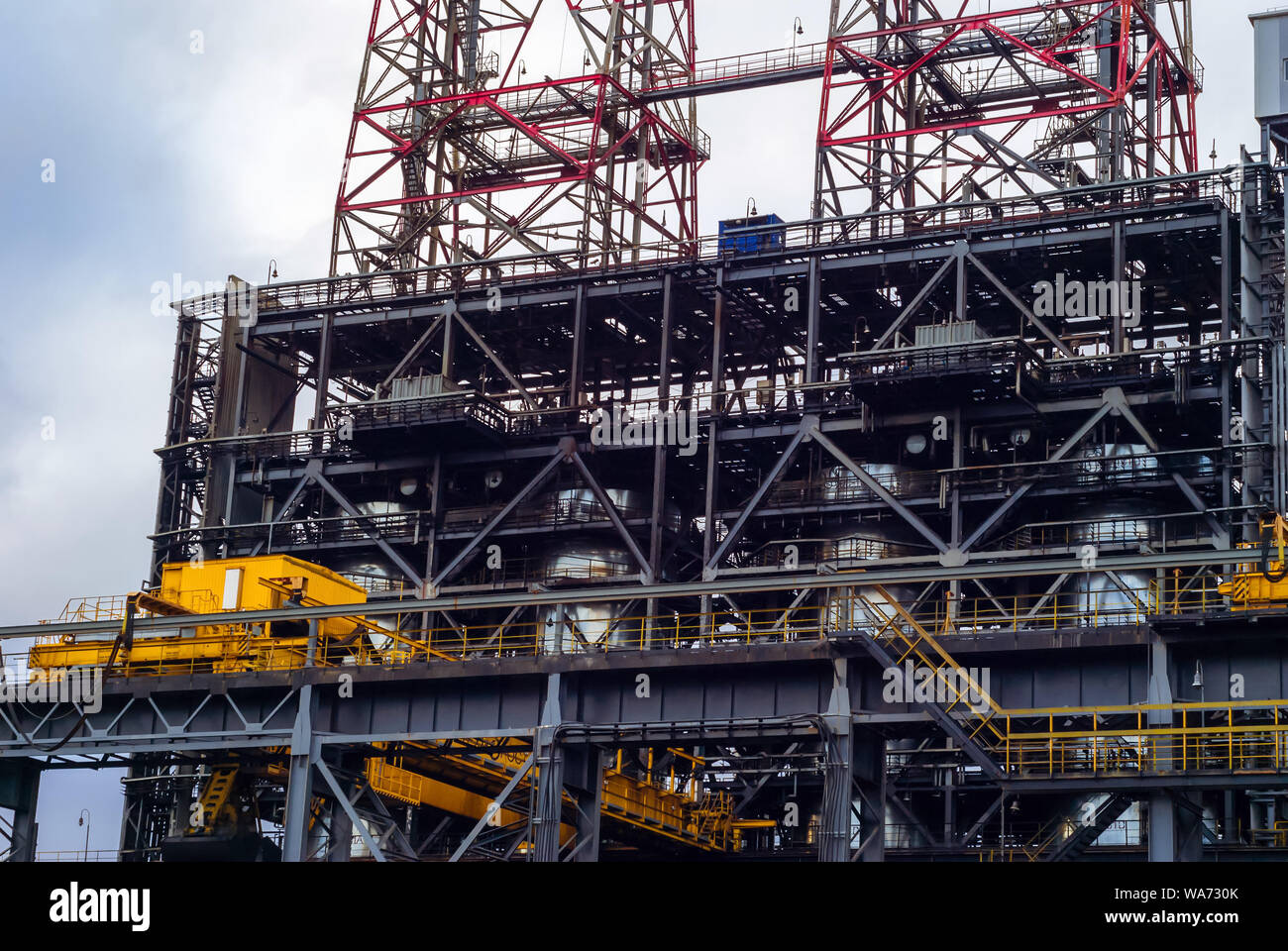 industrial background - fragment of delayed coking unit against the sky ...