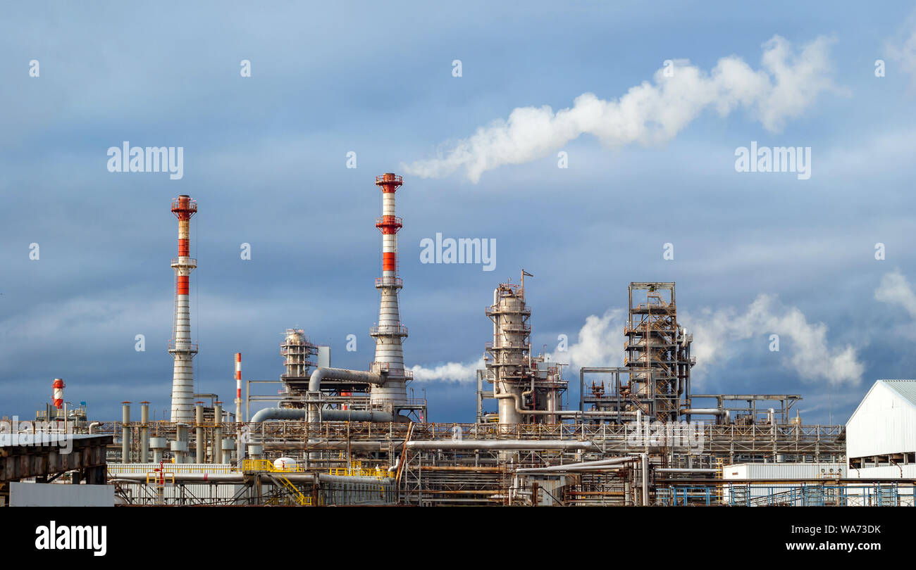 Smoking refinery chimneys hi-res stock photography and images - Alamy