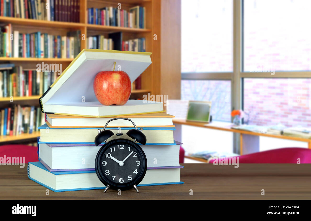 blurry background of a corner of library with book in the front for ...