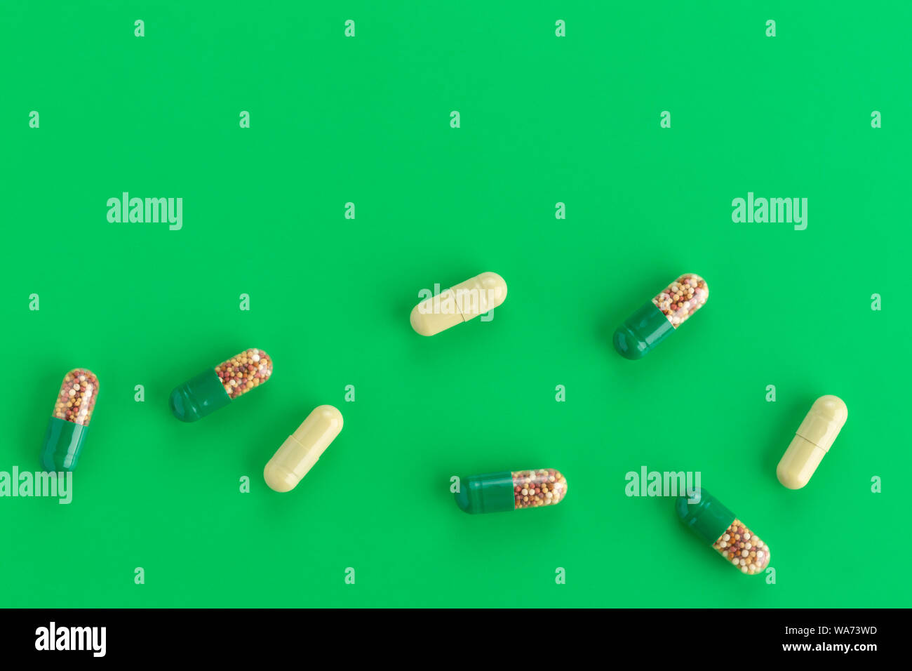 various capsules with antibiotics on a colored background Stock Photo ...