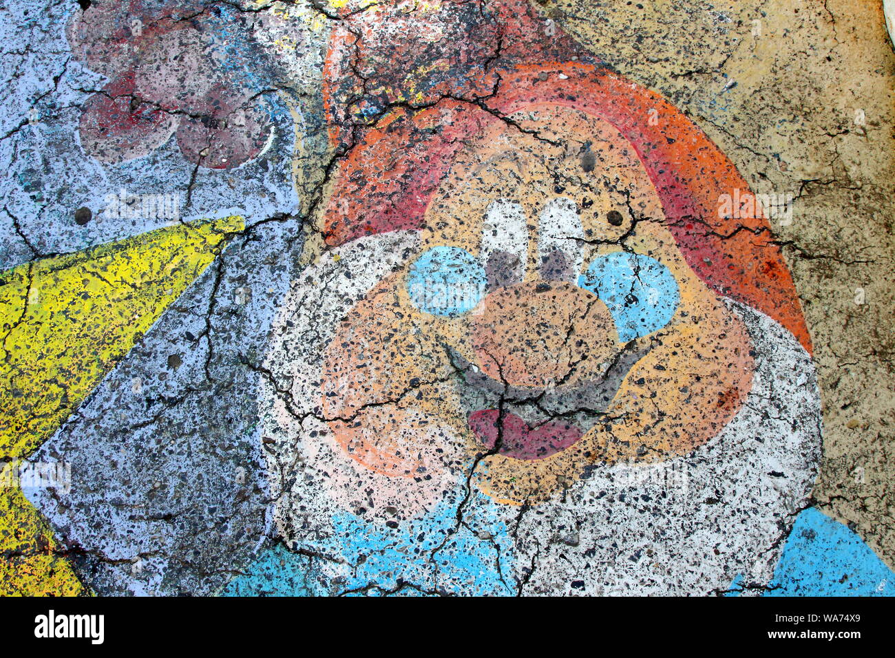 Decomposing children's drawings on asphalt Stock Photo - Alamy