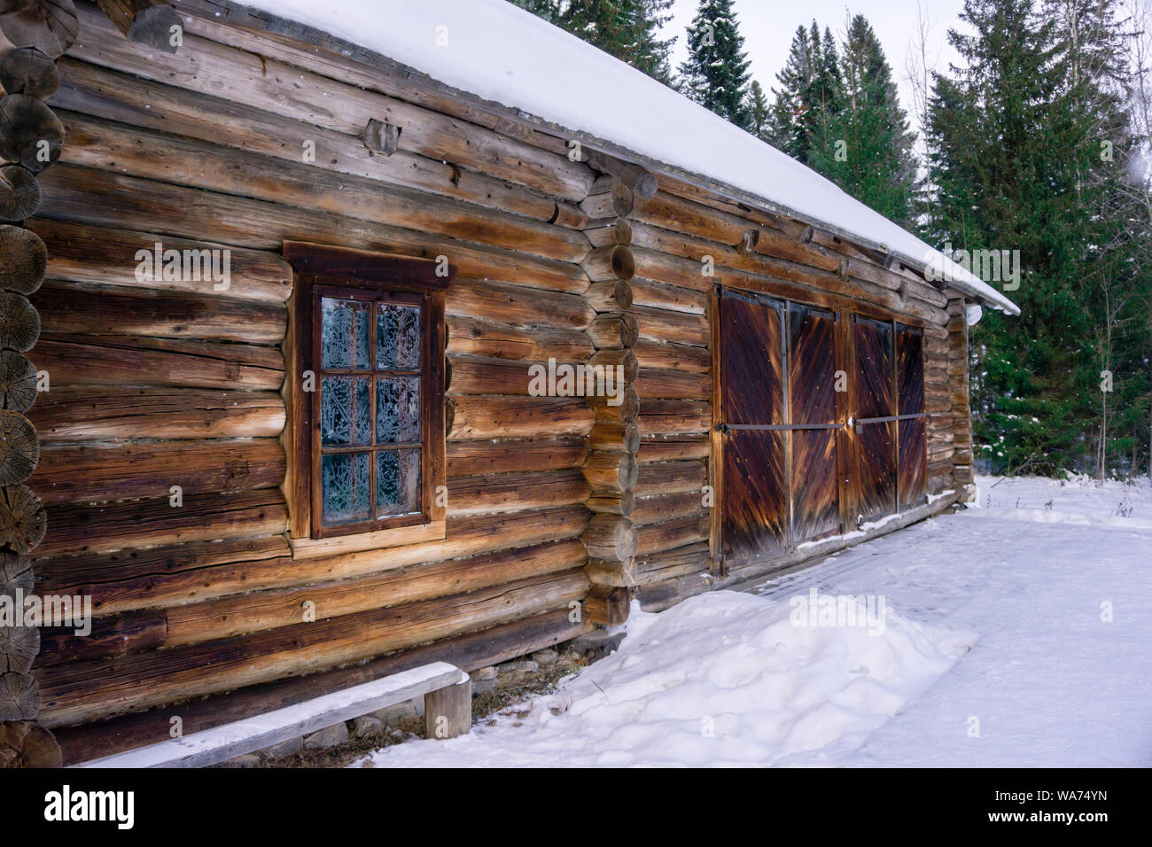 Fire wood with a barn in a snow landscape hi-res stock photography and ...