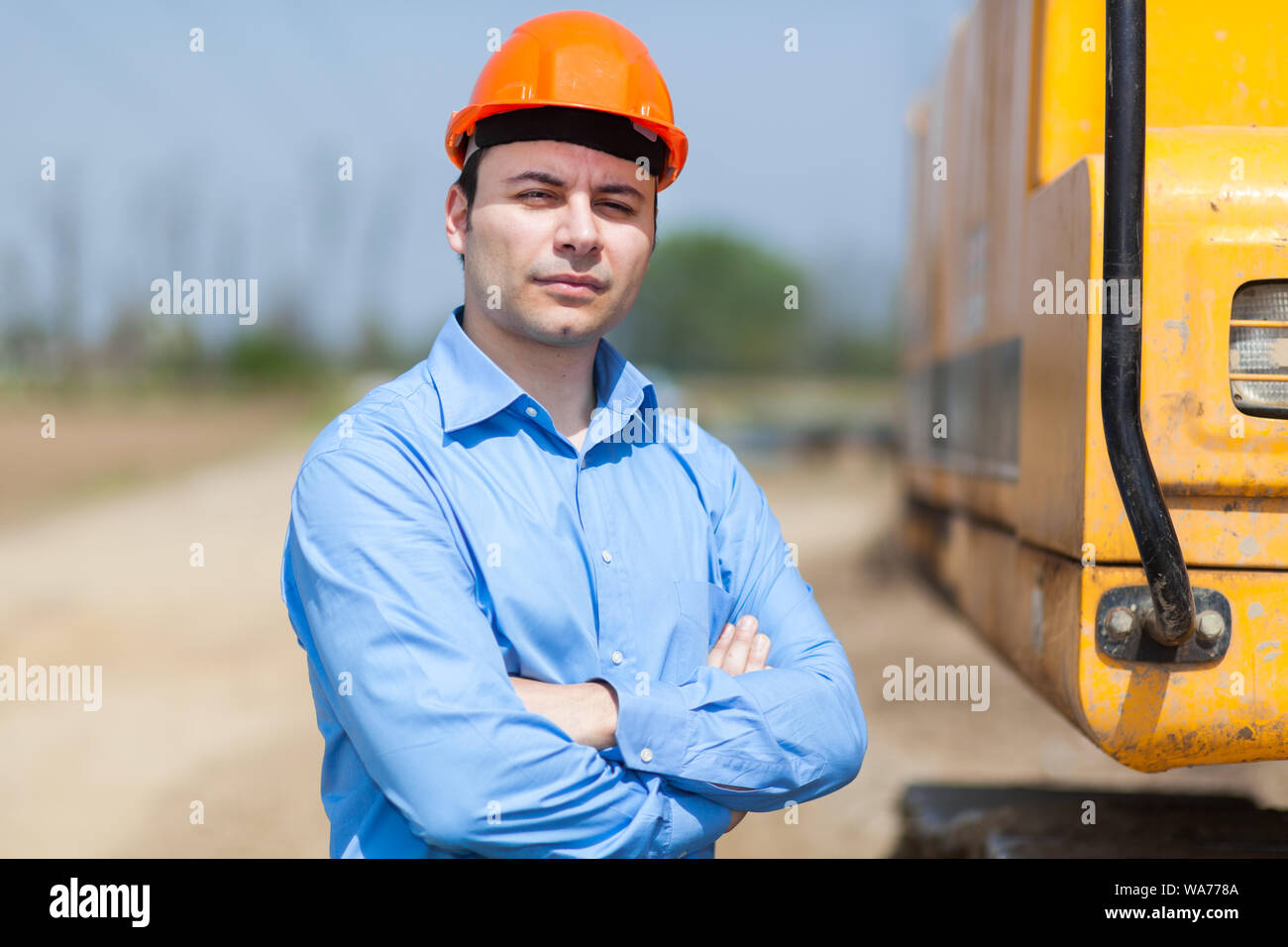 Portrait of worker in a construction site Stock Photo - Alamy