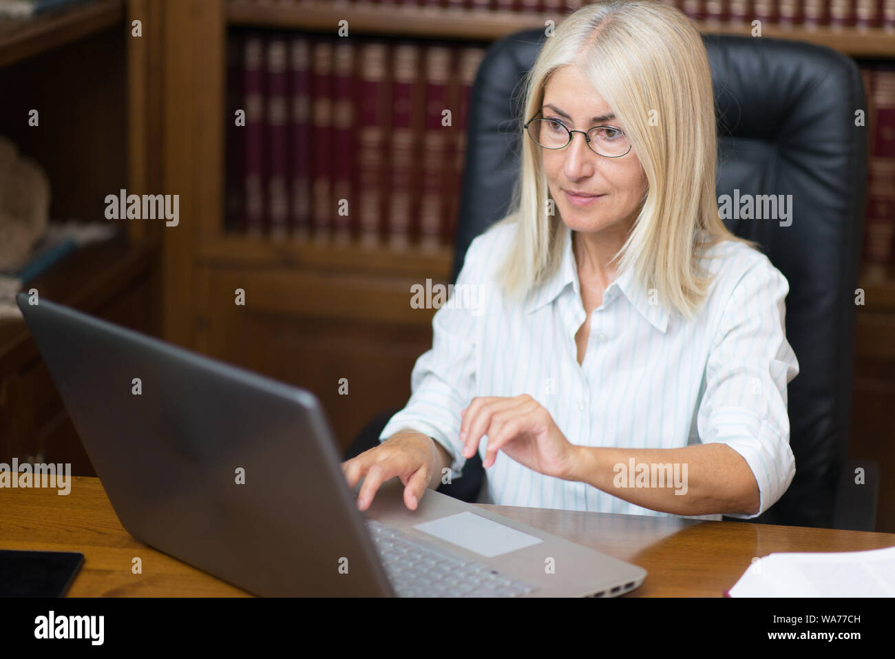 Mature woman using her laptop computer Stock Photo - Alamy